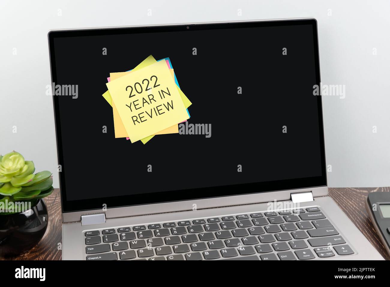 Adhesive note with text 2022 year in review on laptop screen Stock ...