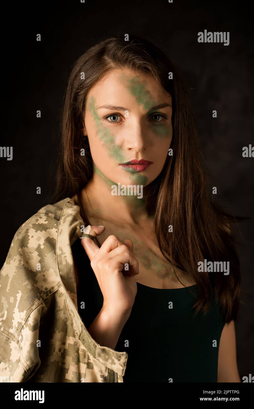 female defender with striped military make-up Stock Photo - Alamy