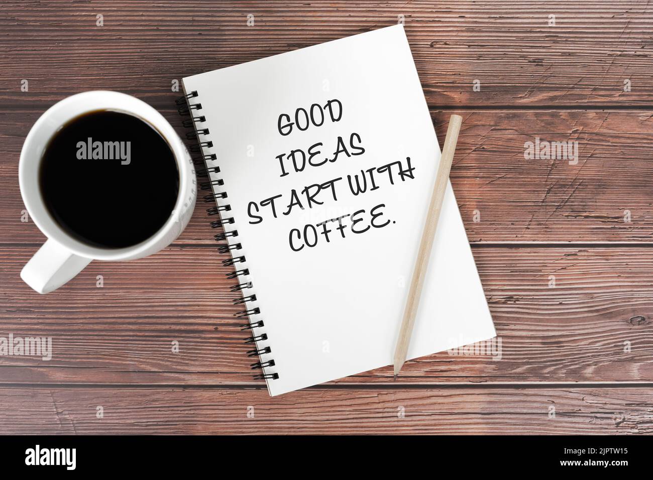 Cup of coffee and note pad with inspirational text - Good ideas start ...