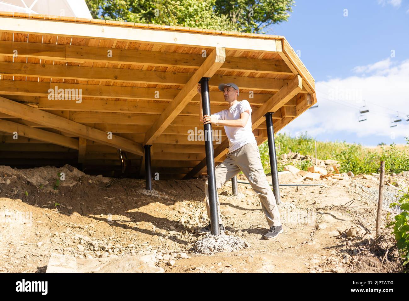 the craftsman builds a wooden terrace Stock Photo - Alamy