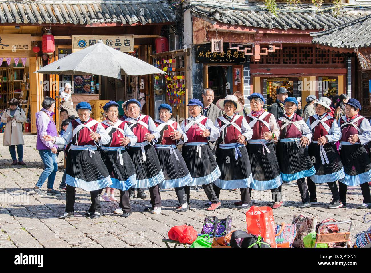 he old women from the Naxi nationality dressed with traditional ...