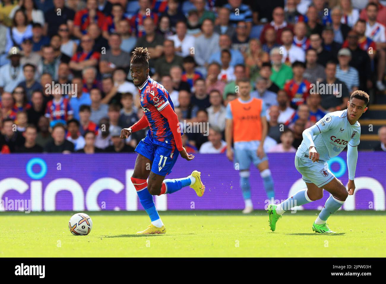 Wilfried Zaha of Crystal Palace evades Jacob Ramsey of Aston Villa ...