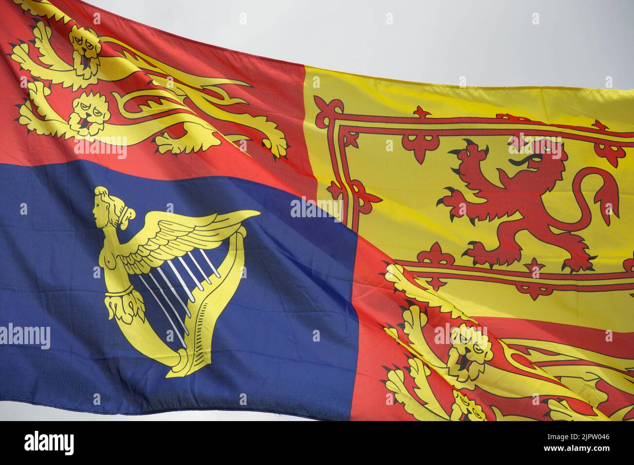 Heraldic flag. The Royal Standard of the United Kingdom blows in the ...