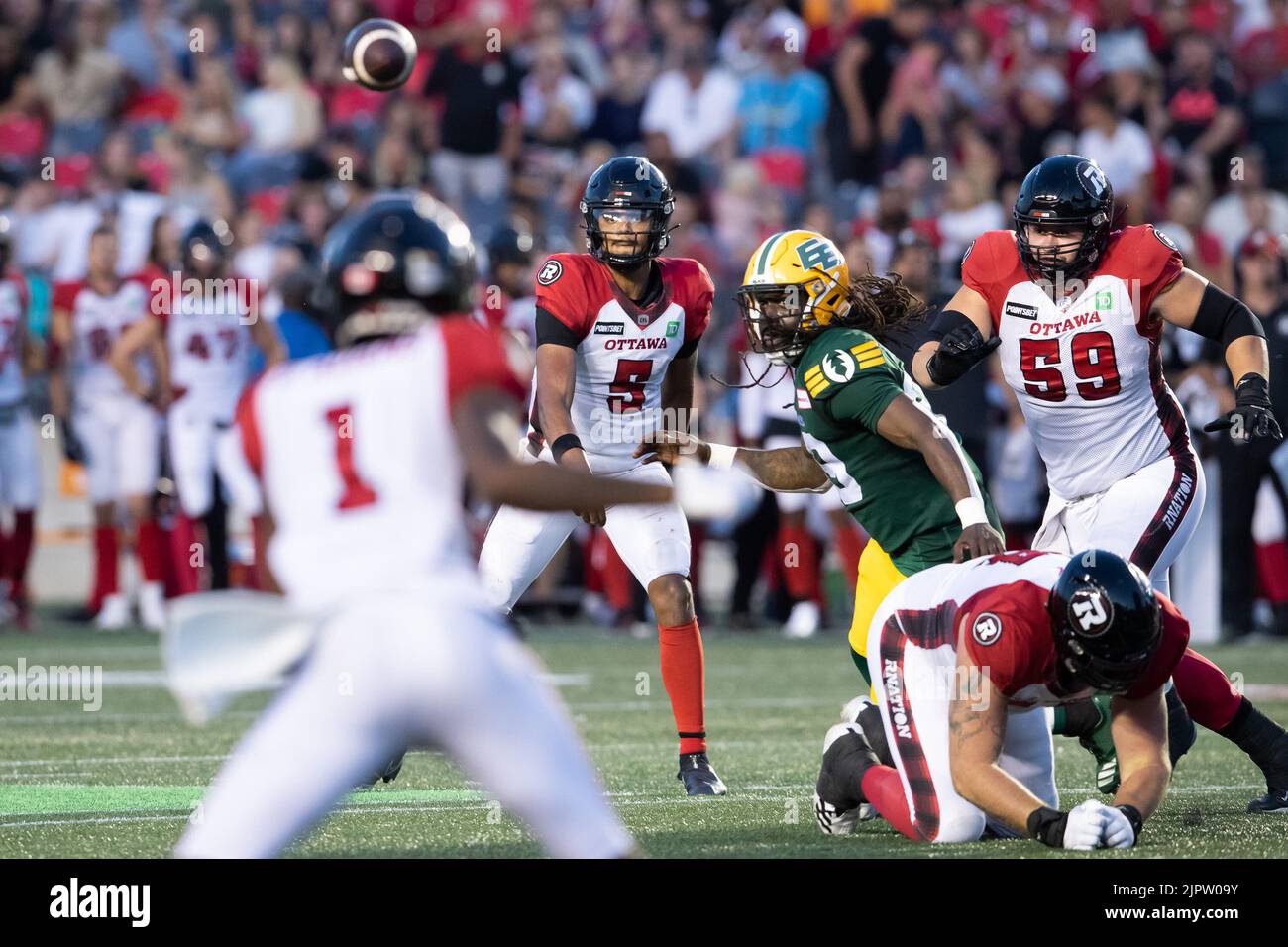 August 19, 2022: Ottawa Redblacks quarterback Caleb Evans (5) throws ...