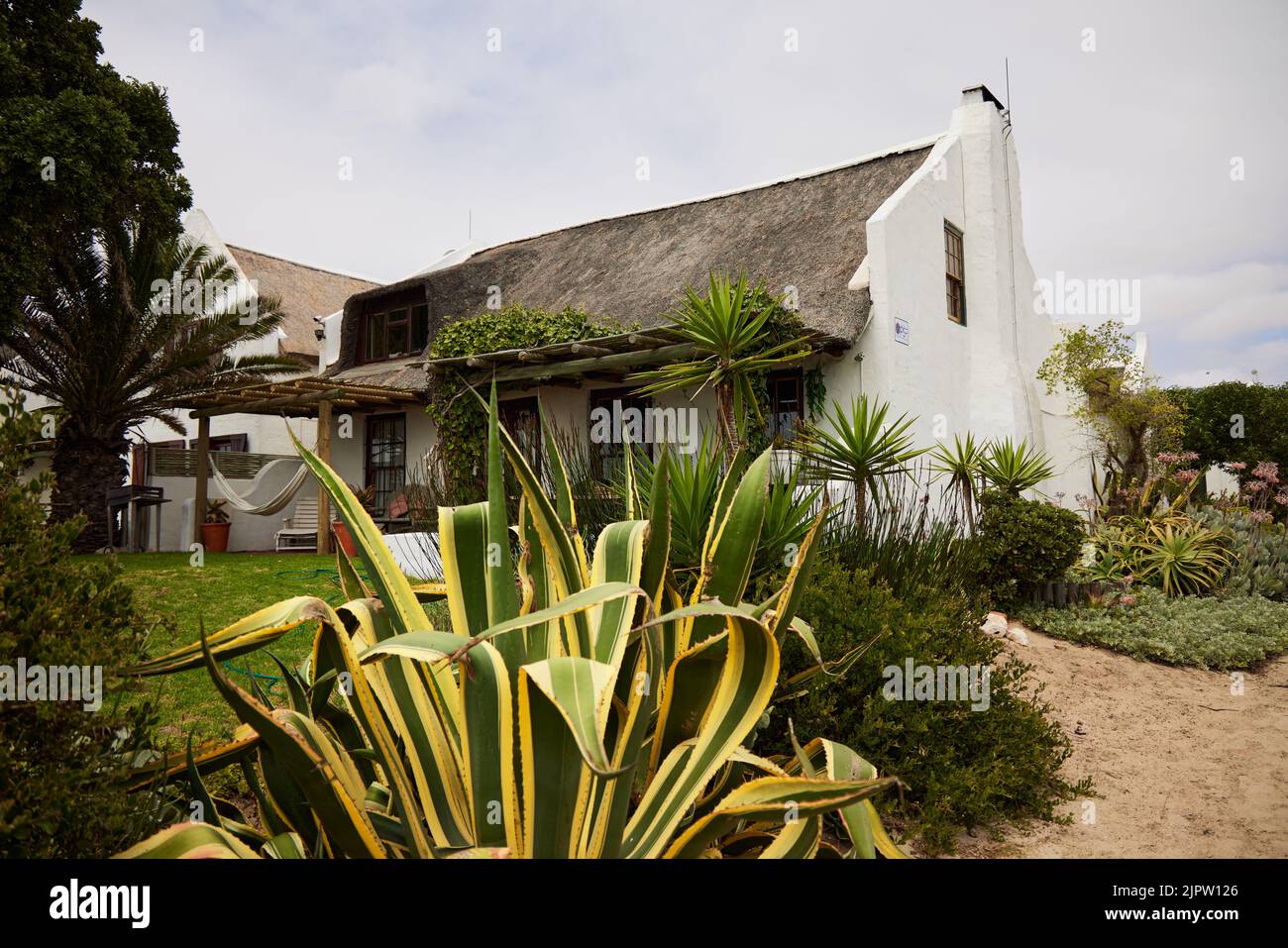 An old stone house with a garden of exotic plants in Paternoster ...