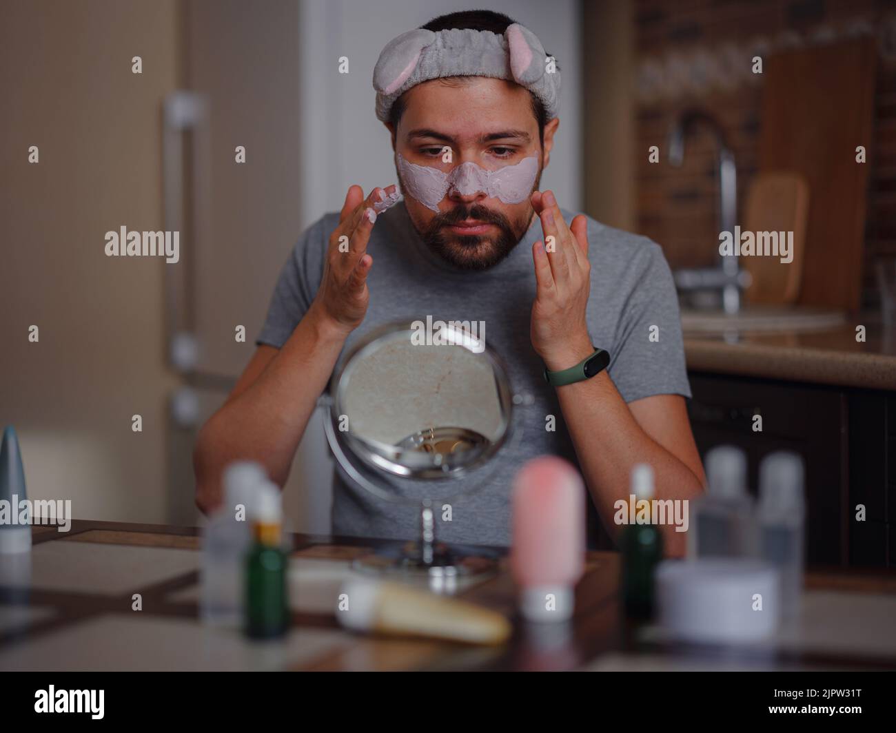 Men's beauty concept. caucAsian guy checking his skin. man looking into ...
