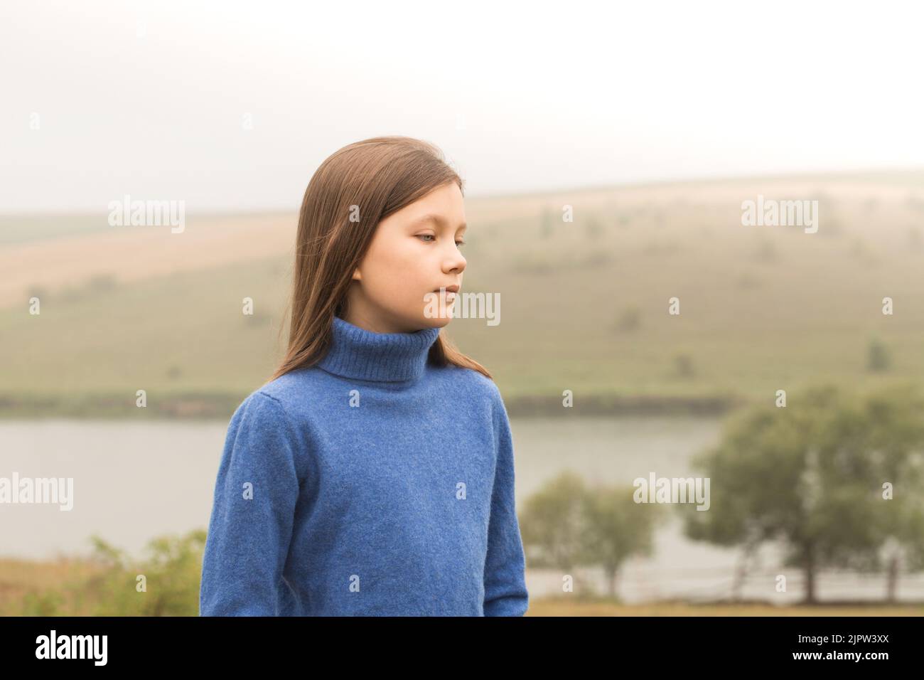 A beautiful young girl was alone in nature in a foggy morning Stock ...