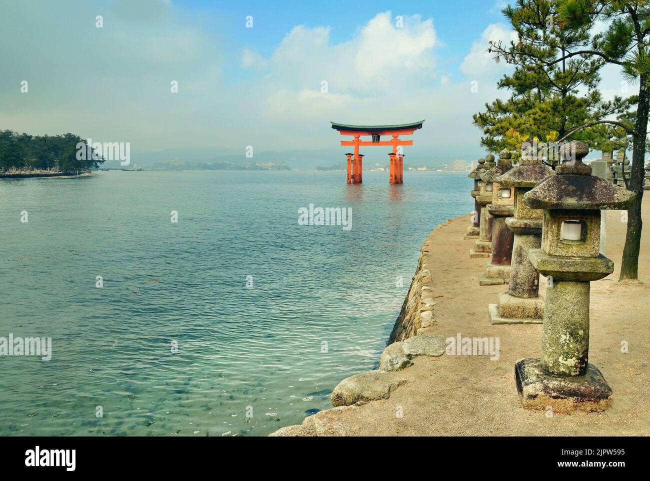 Torii of Miyajima shrine and japanese lanterns. Itsukushima island ...