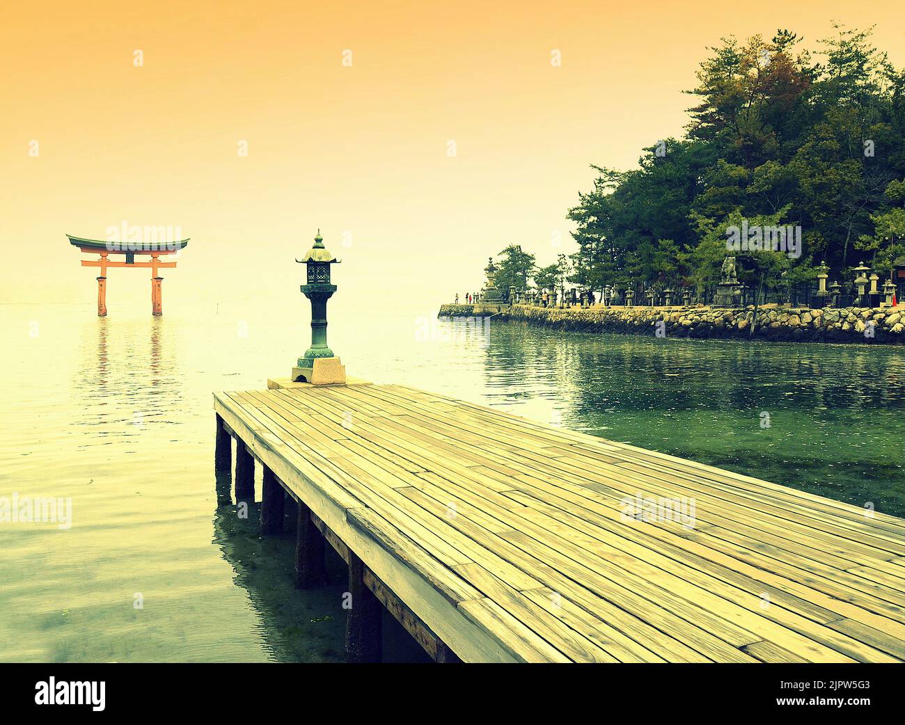Bronze lantern and torii gate at Miyajima island, Itsukushima ...