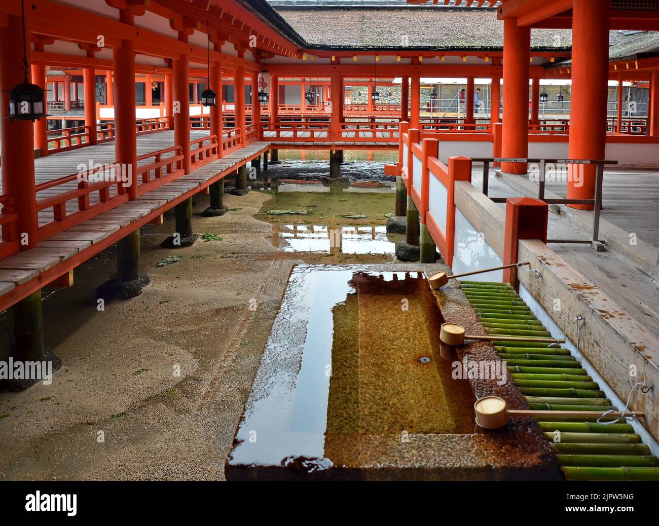 Purification fountain at Itsukushima-jinja, a Shinto shrine in Miyajima ...