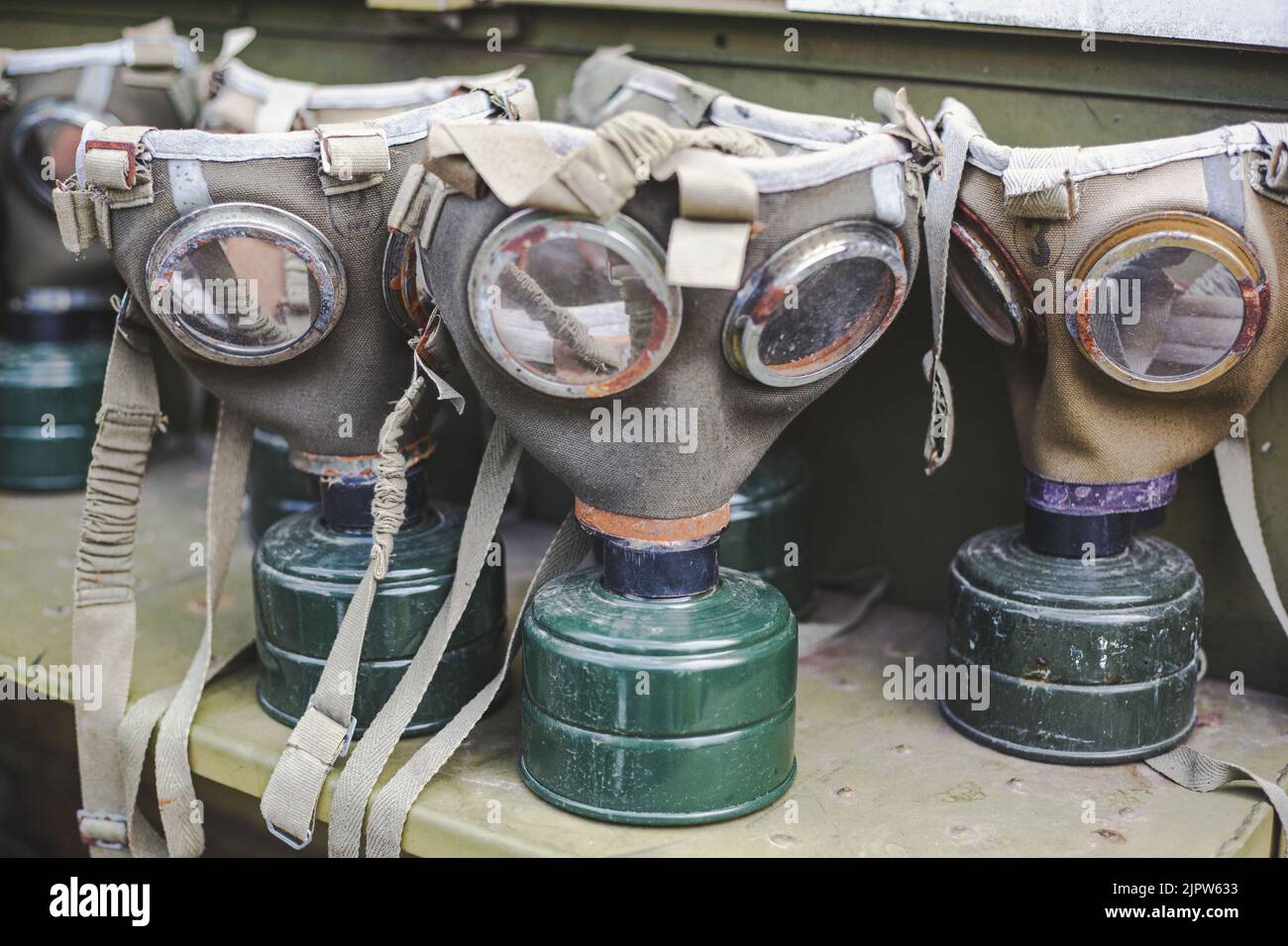 A row of old gas masks bunched up in a line Stock Photo - Alamy