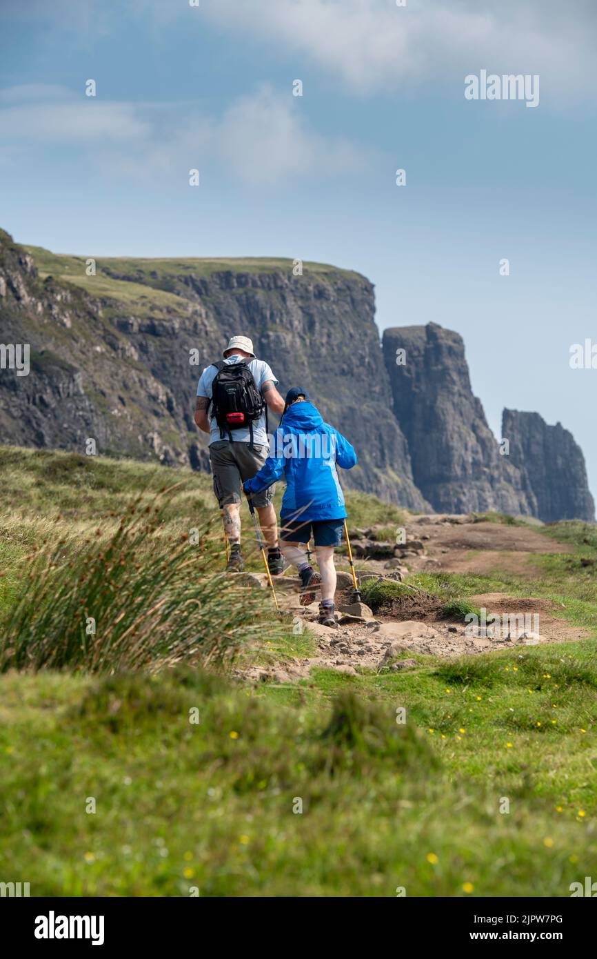 Hikers walking near the Quiraing on the Isle of Skye, Scotland, UK ...