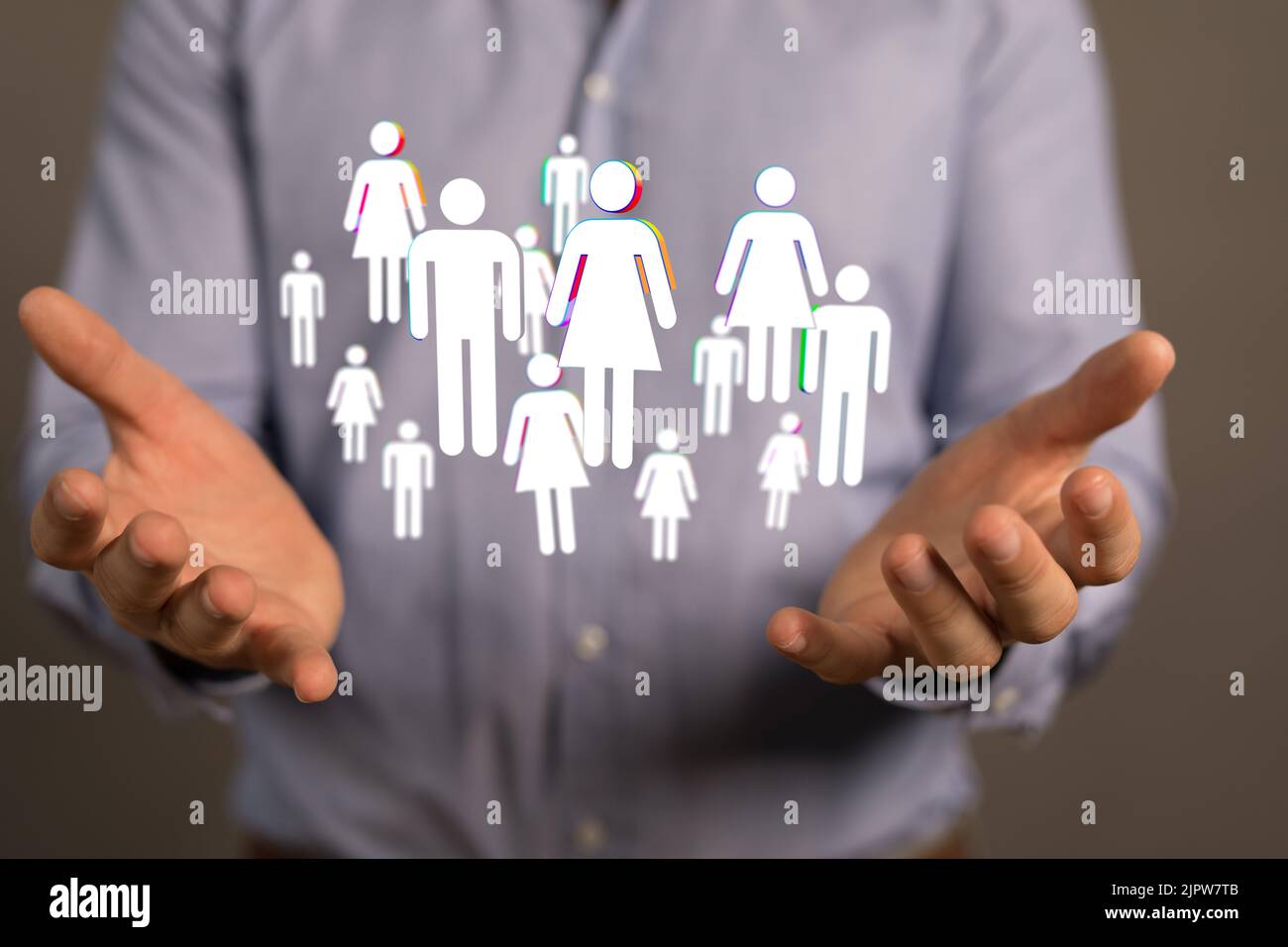 The hovering people icons between hands Stock Photo - Alamy
