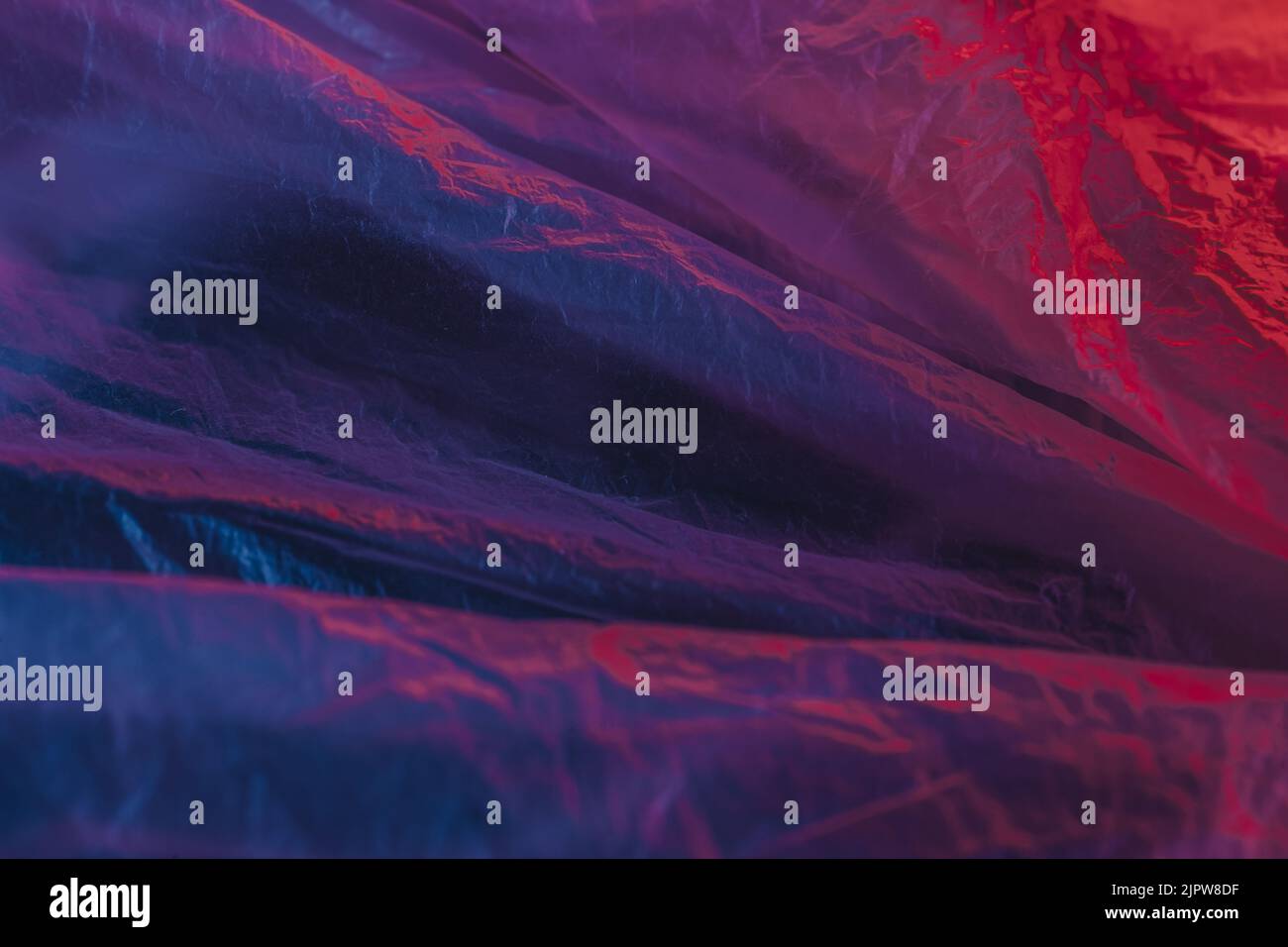 Polyethylene under neon. Plastic texture under ultraviolet light Stock ...