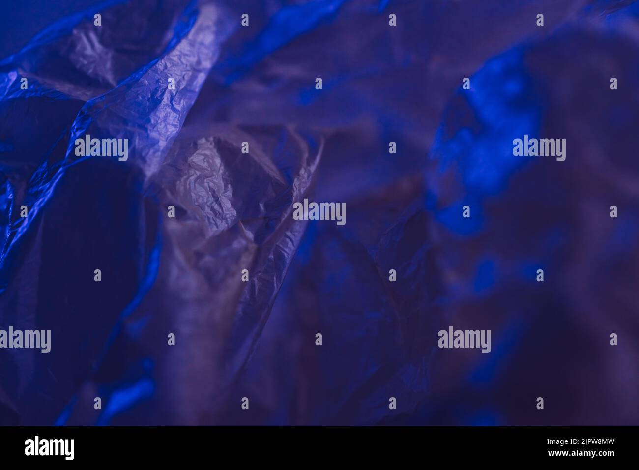 Blue polyethylene. Heterogeneous texture of polyethylene. Close-up ...