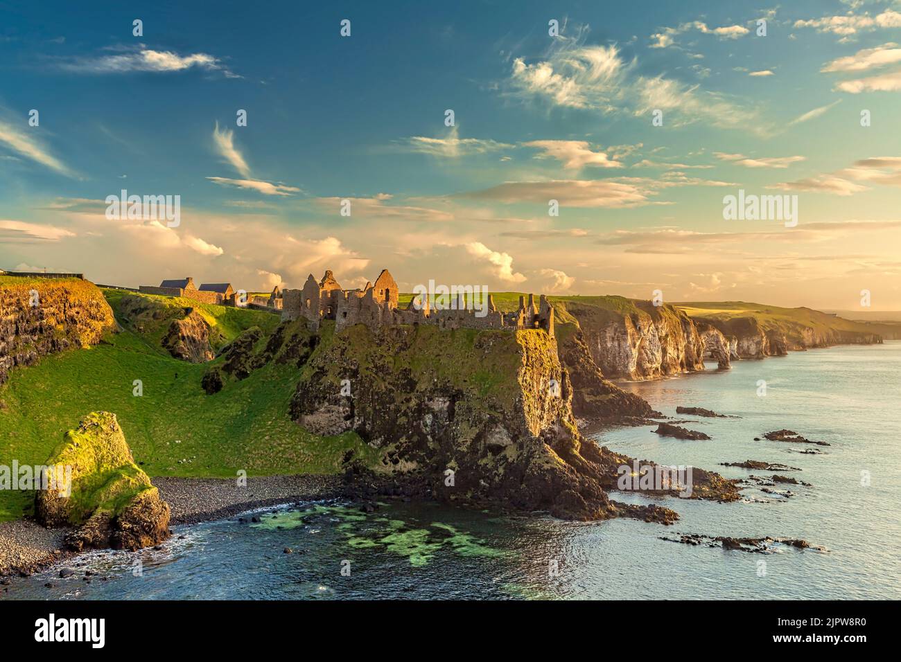 Dunluce castle is located near the coastal town of Portrush in County ...
