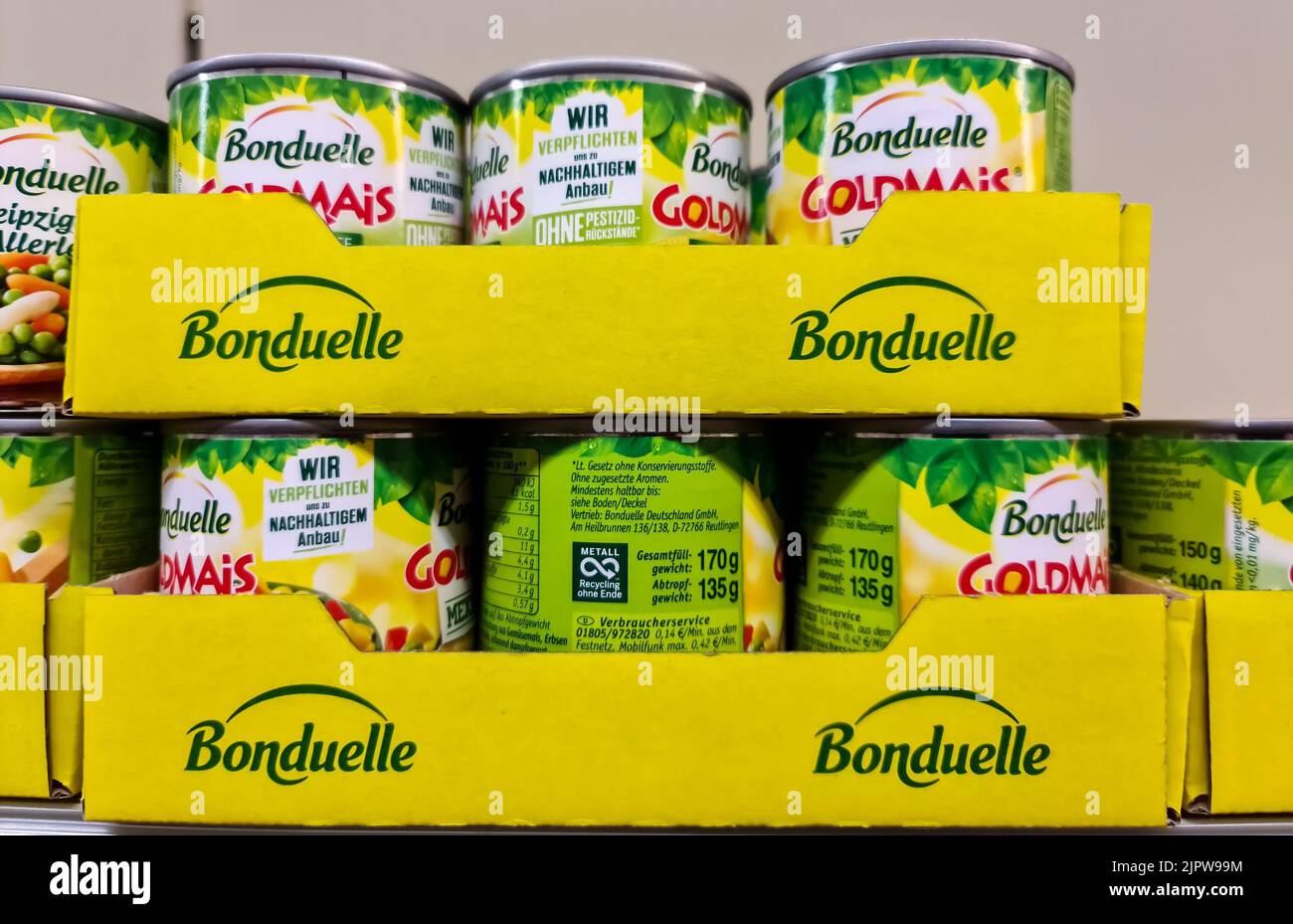A closeup of several cans of Bonduelle brand corn for sale on a ...