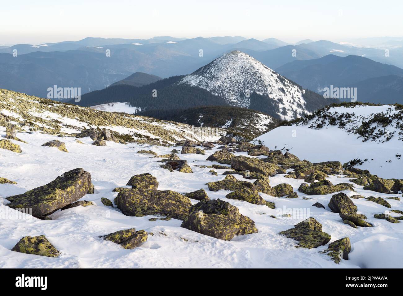 Spring landscape with melting snow and mountain view Stock Photo - Alamy