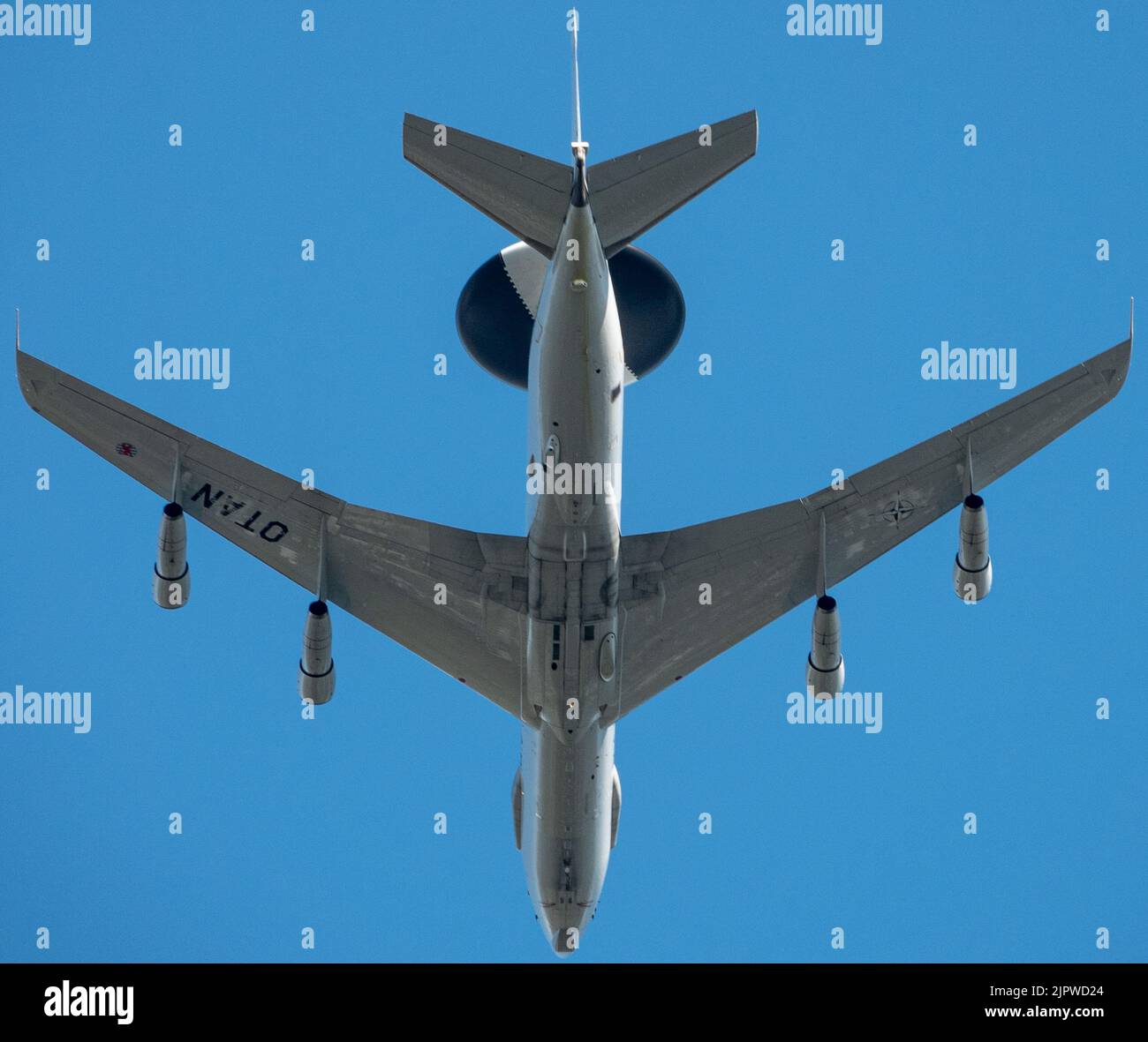 A low angle shot of a flying airplane Stock Photo - Alamy