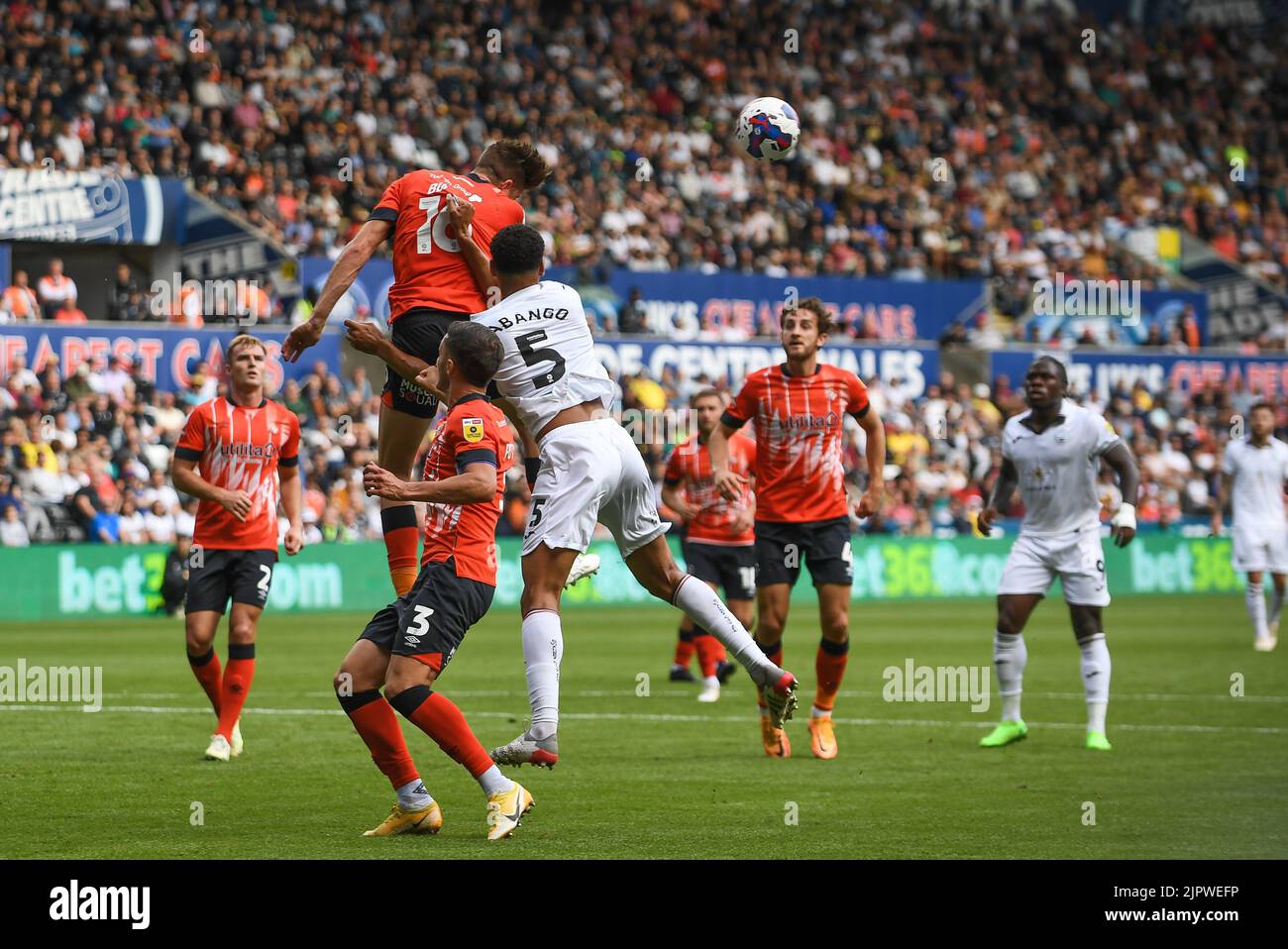 Reece Burke #16 of Luton Town clears his defence Under pressure from ...