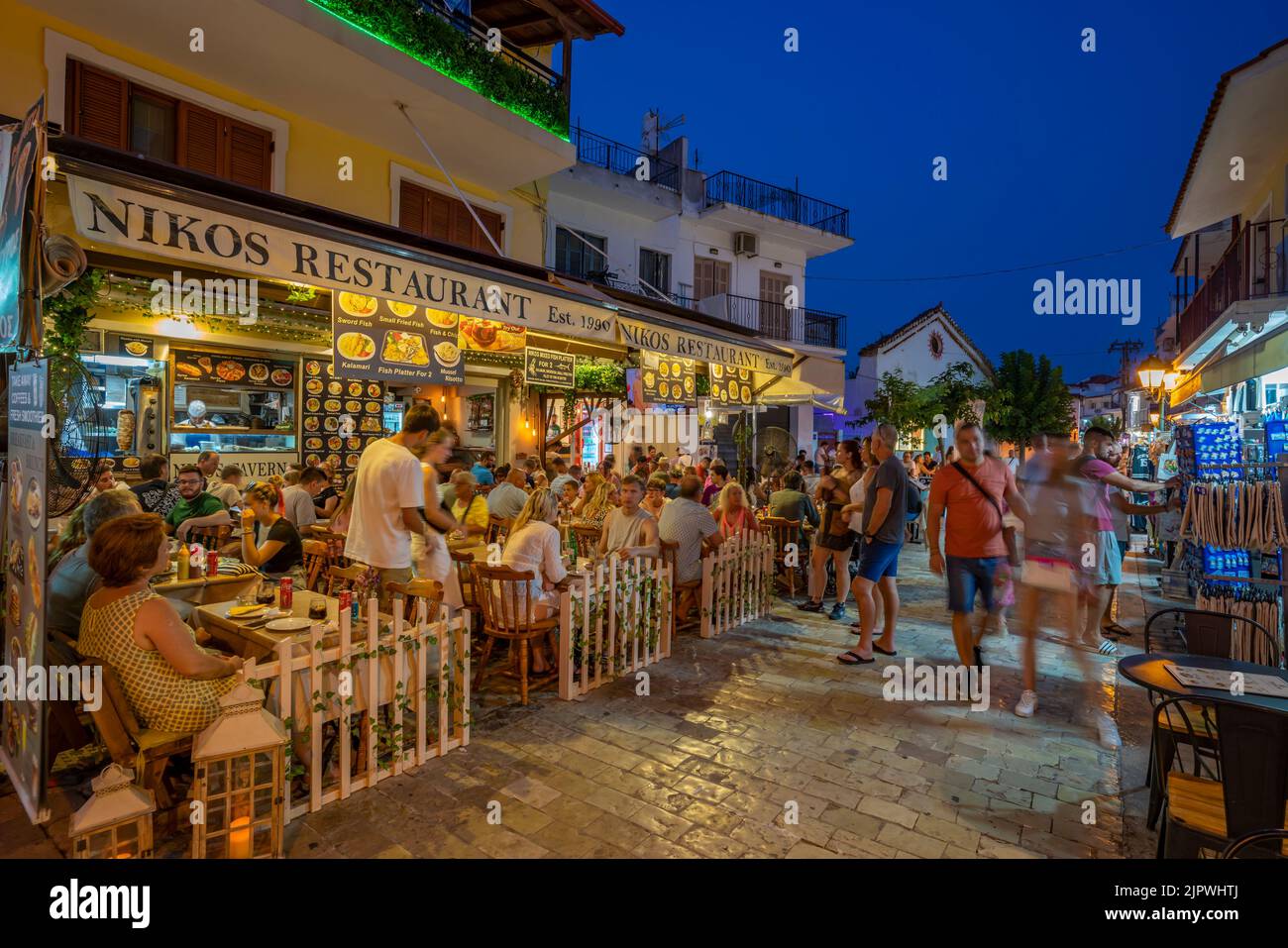Busy street and nightlife in Skiathos Town, Skiathos Island, Sporades ...