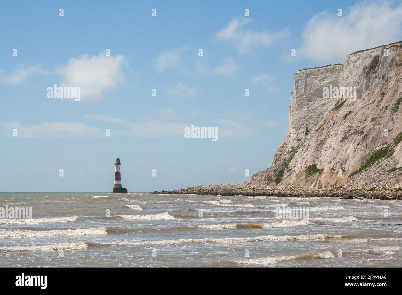 Beachy Head Lighthouse and the coastline below the white cliffs in East ...
