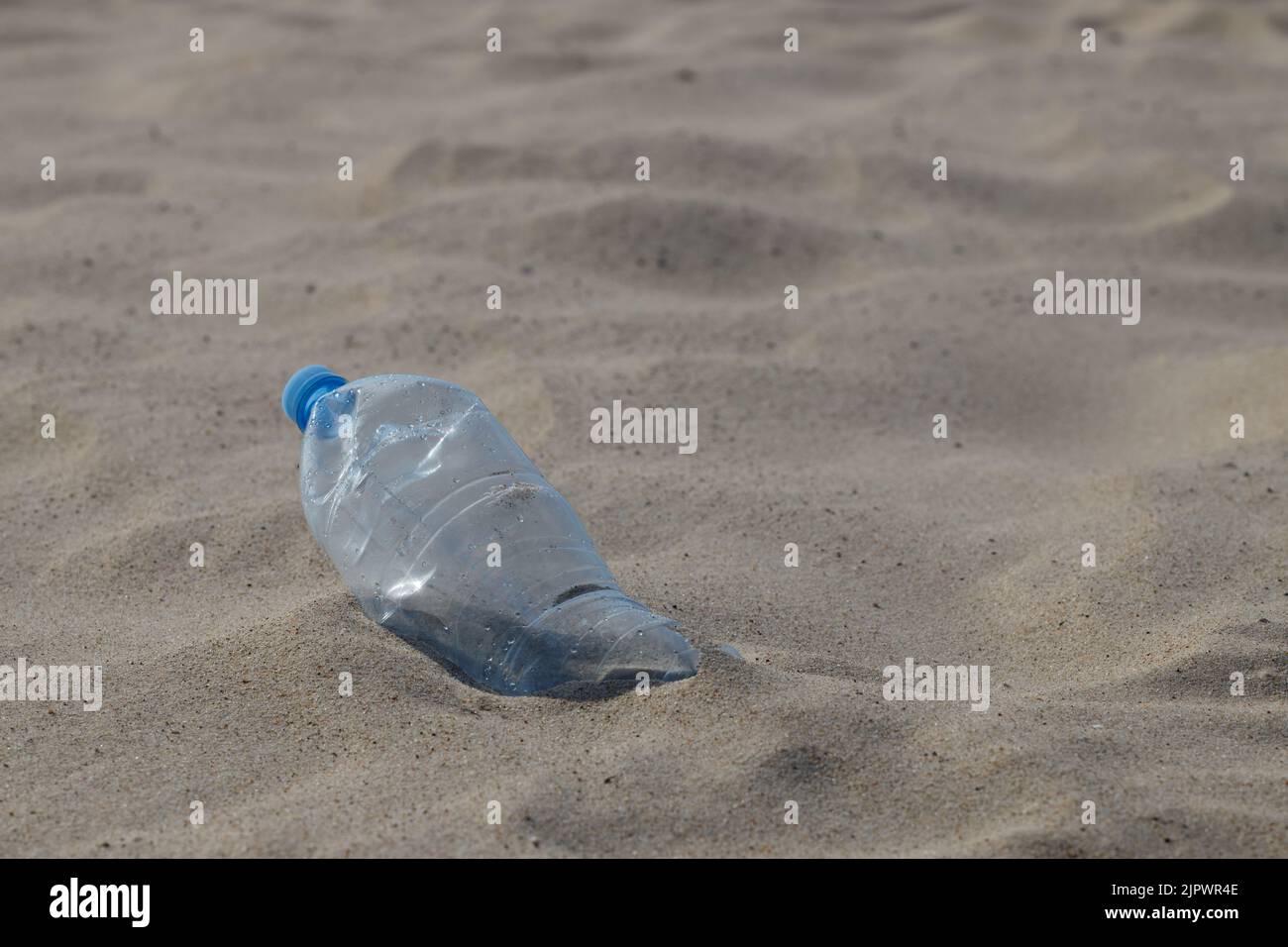 Land and sea pollution, environmental problem, used plastic bottle on ...