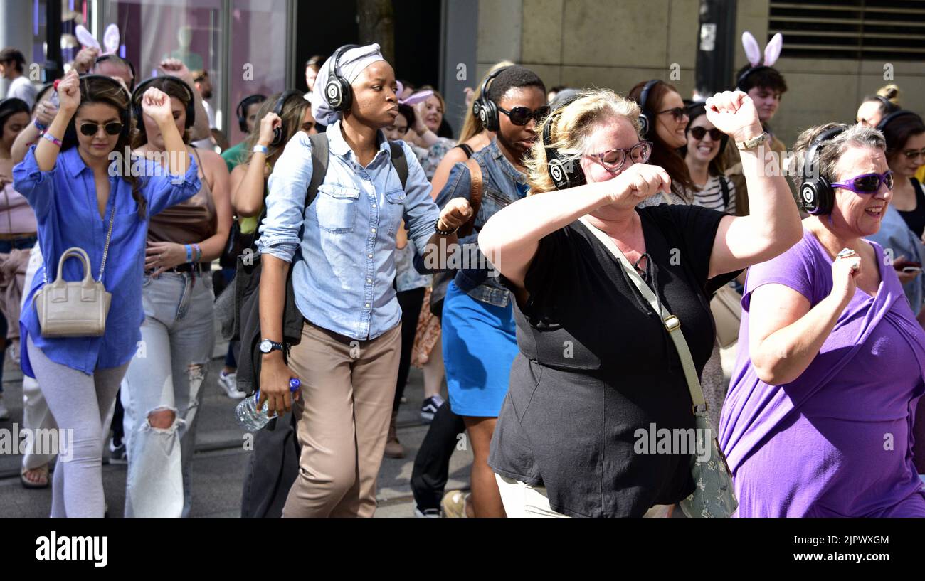 A group of people, wearing headphones. on a 'Silent Adventures ...