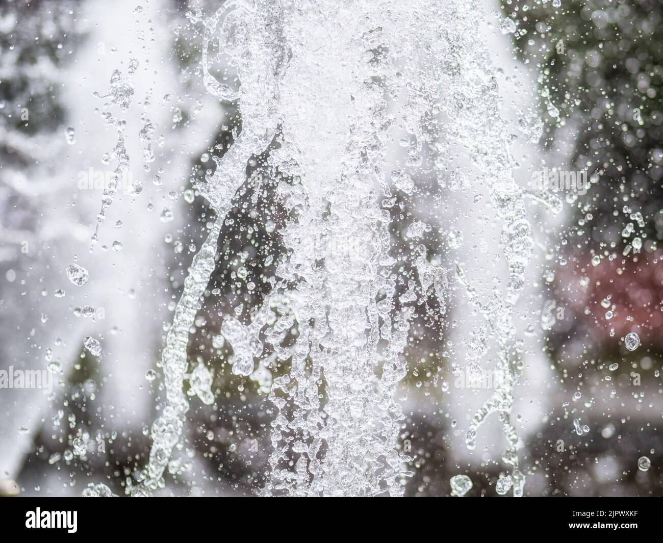 Water splashes from fountain on dark background. Natural texture of ...