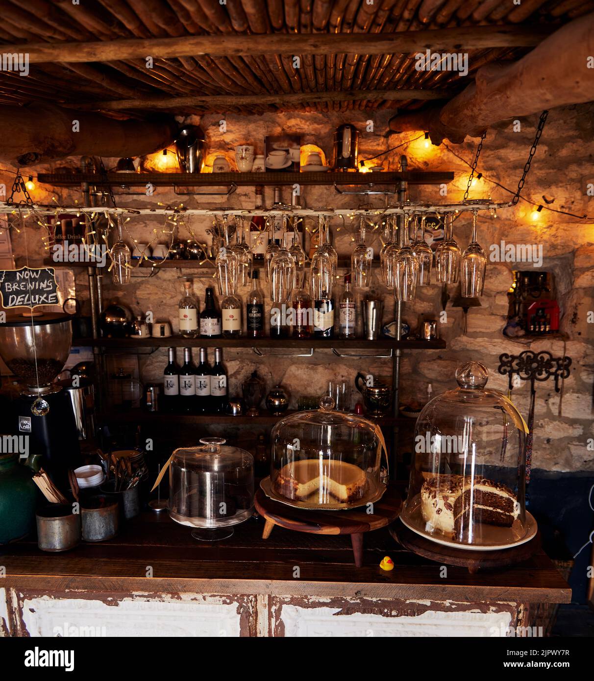 A vertical shot of interior with delicious cakes and drinks of the ...
