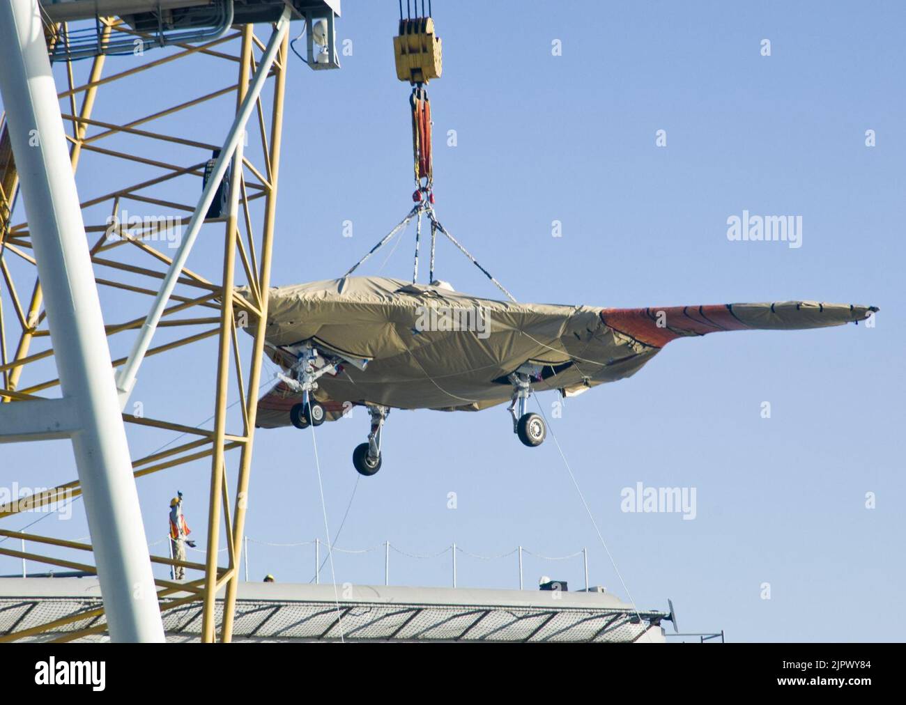 The X-47B Unmanned Combat Air System demonstrator is loaded onto USS ...