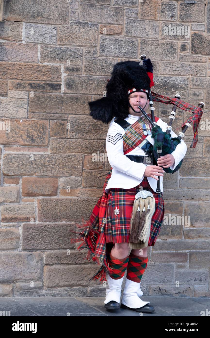 Man in traditional Scottish outfit with bagpipe on the street Stock ...