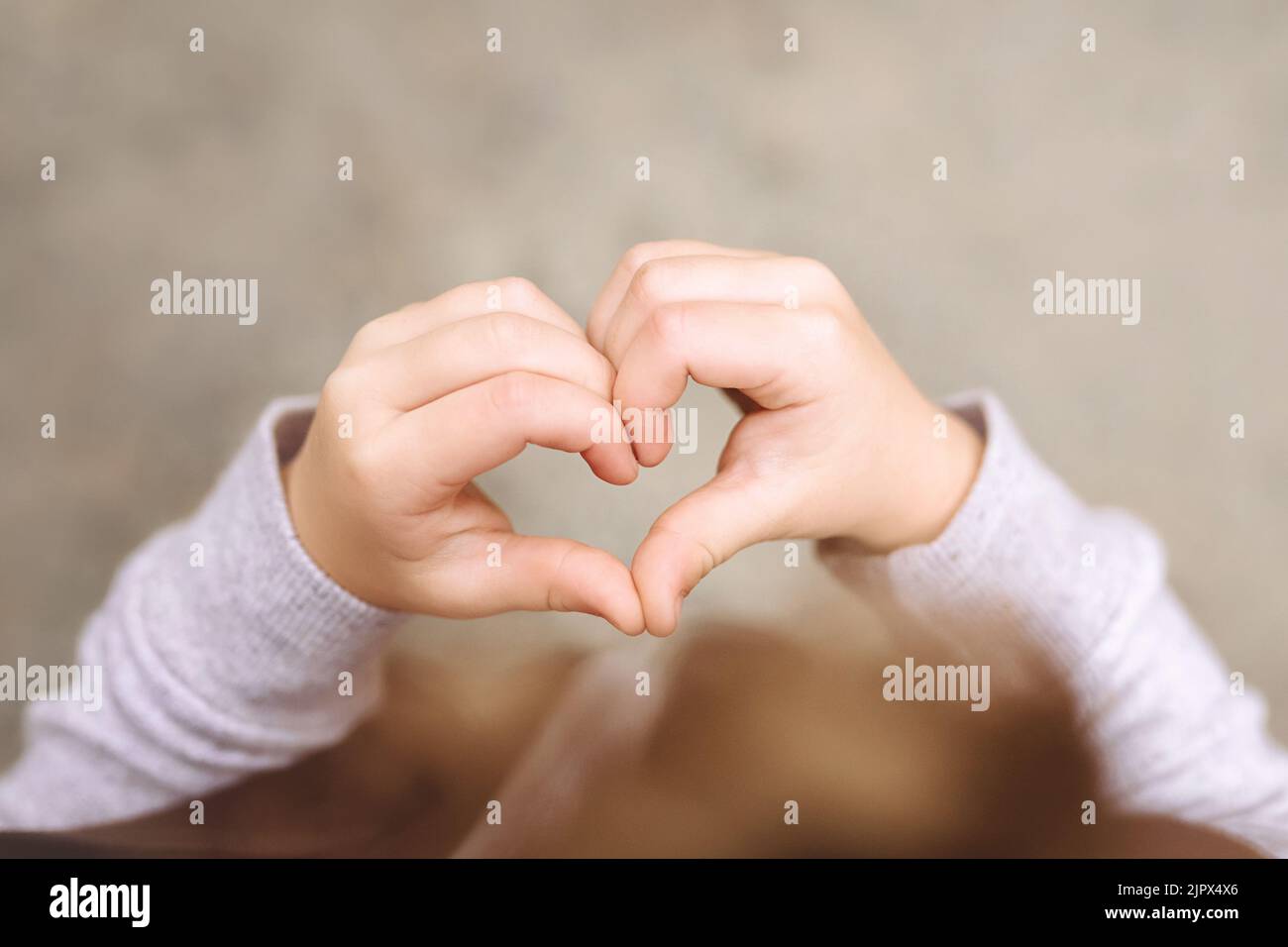 Child hand making heart hi-res stock photography and images - Alamy