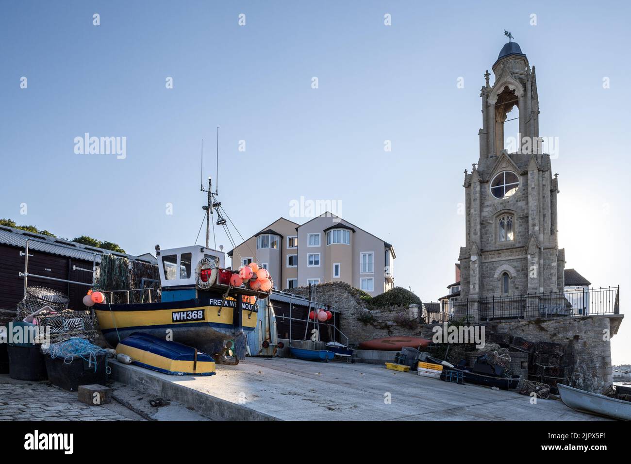 Wellington Clock Tower and dry docked fishing boat, Peveril, Swanage ...