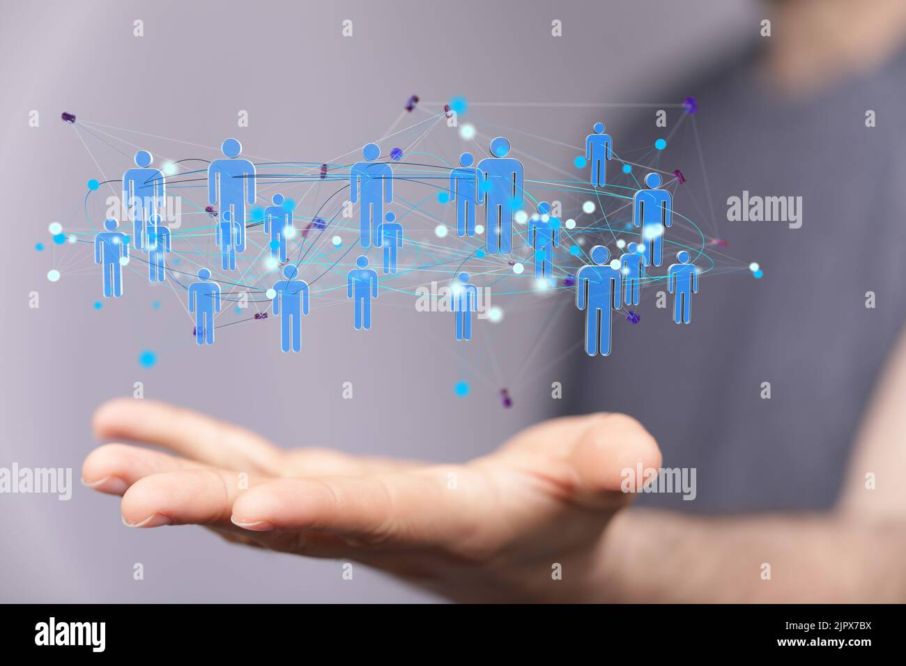 A 3D rendering of people icons floating in a person's hand Stock Photo ...