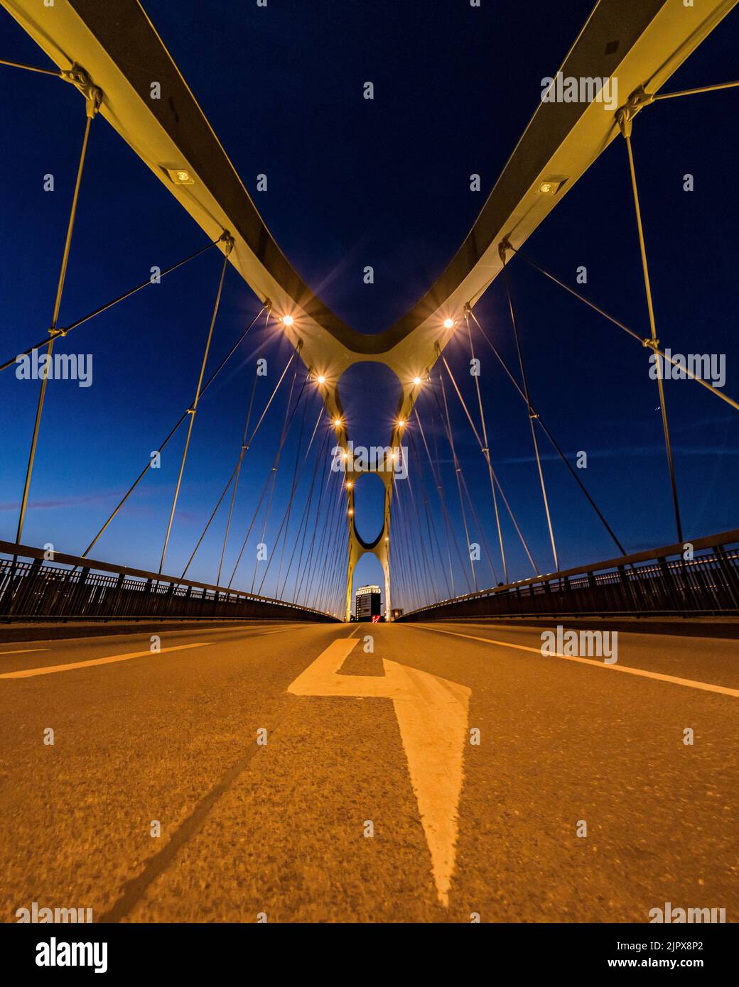 A beautiful shot of Deutschherrn bridge cables and lights during the ...
