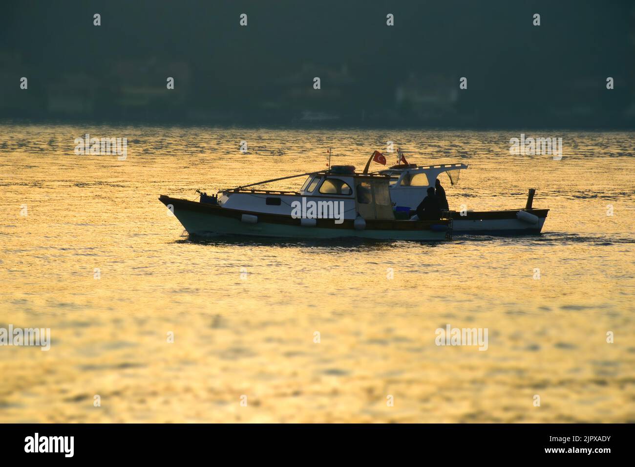 Men on a boat in Bosphorus waters in Istanbul. Fisherman in boat in ...