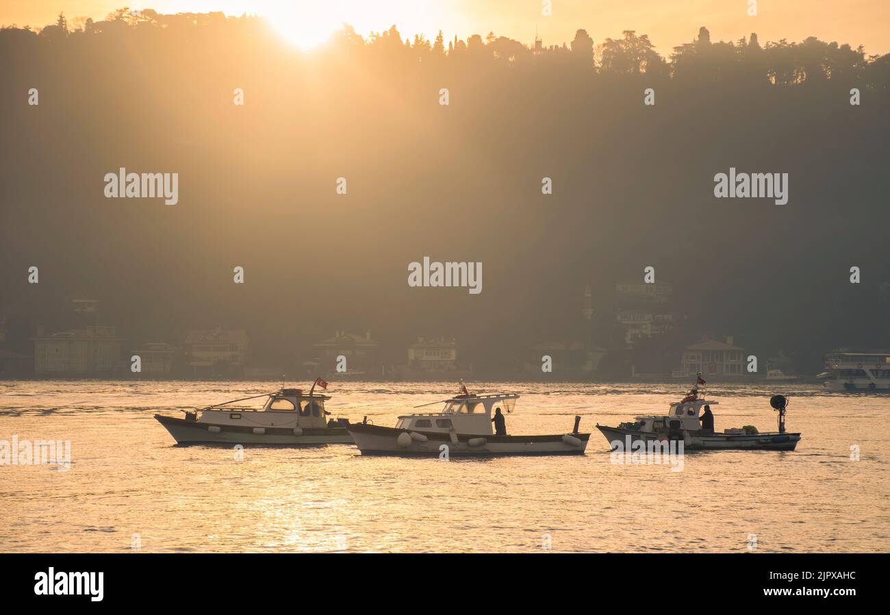 Men on a boat in Bosphorus waters in Istanbul. Fisherman in boat in ...