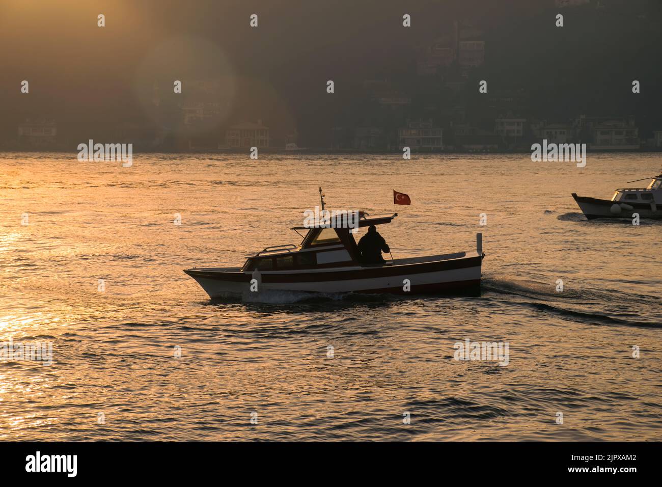 Men on a boat in Bosphorus waters in Istanbul. Fisherman in boat in ...