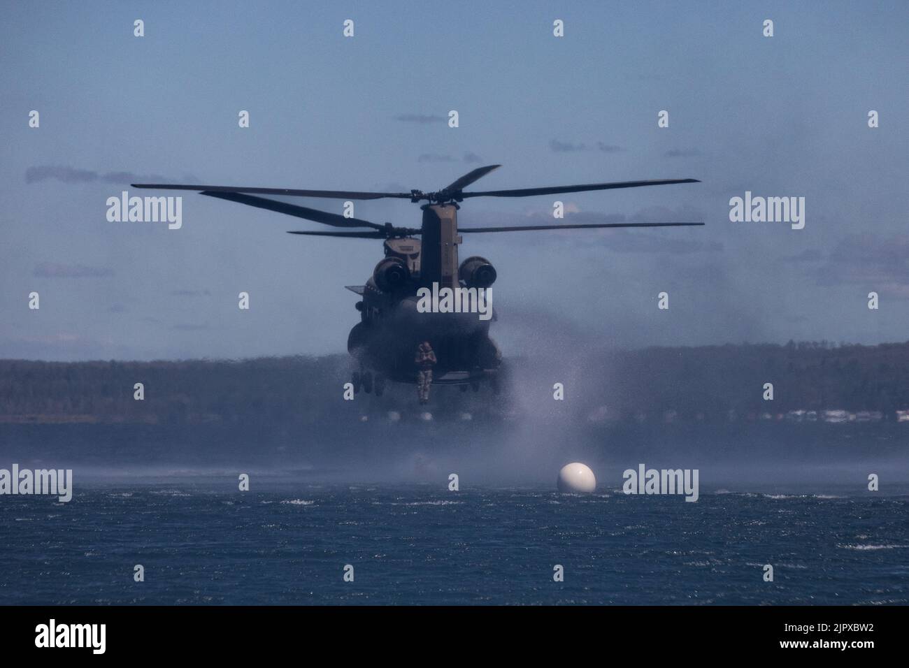 A 20th Special Forces Group (Airborne) soldier jumps out of a CH-47 ...