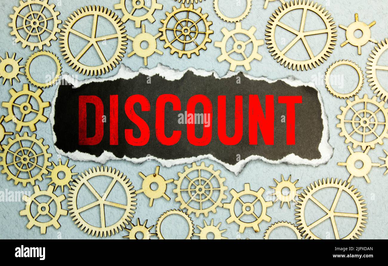 Wooden cubes with the word DISCOUNT stand on a wooden background ...