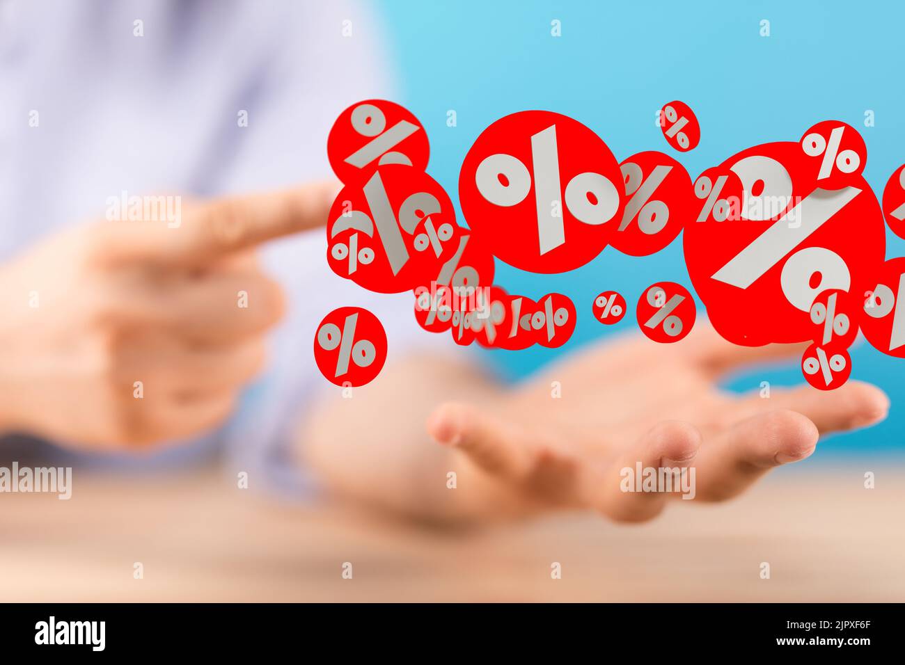 3D rendered percent icons floating above a hand Stock Photo - Alamy