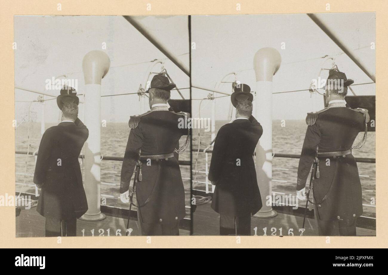 Theodore Roosevelt and a naval officer on deck of ship, their backs to ...