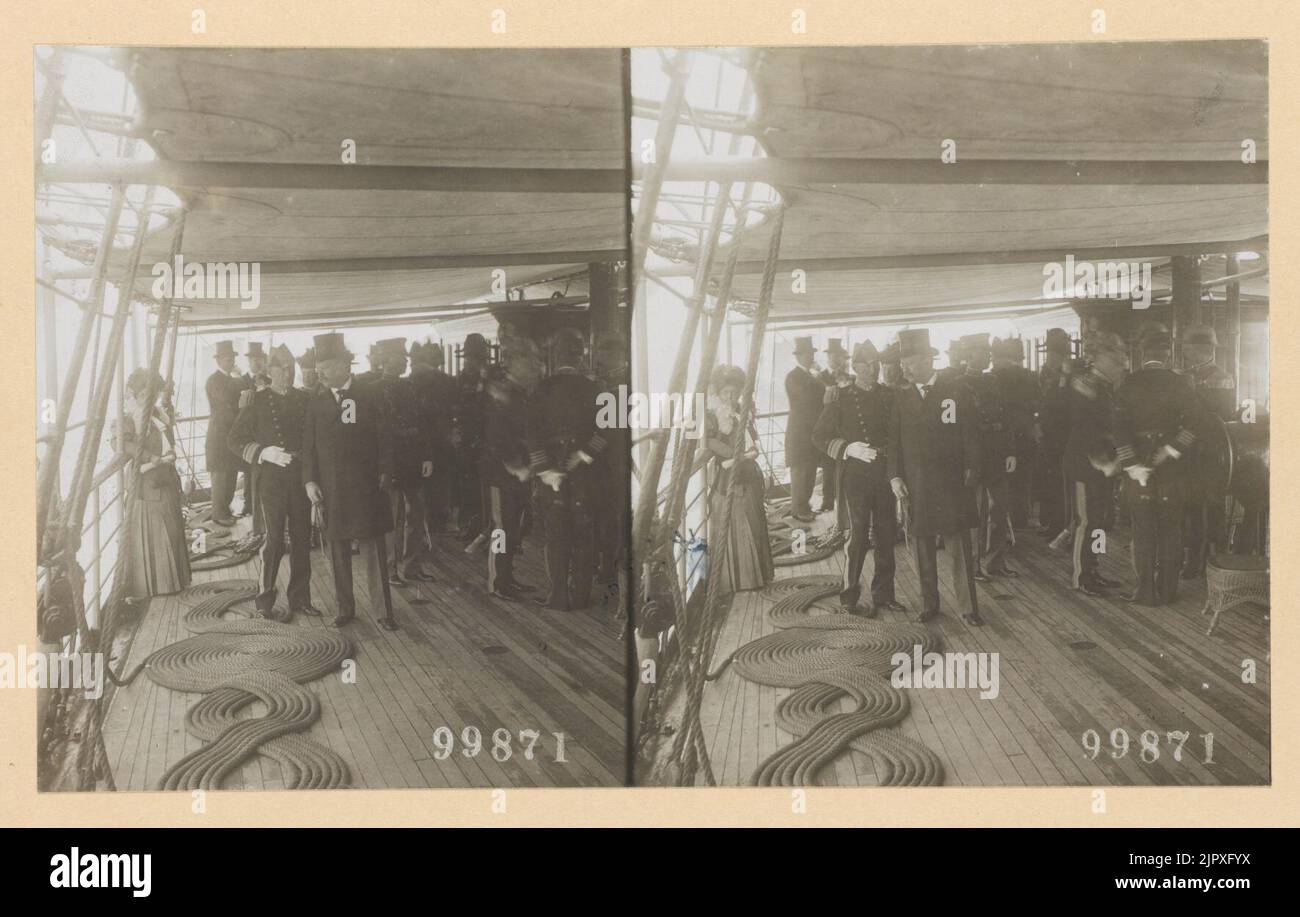 Theodore Roosevelt on deck of ship with group of naval officers. A ...