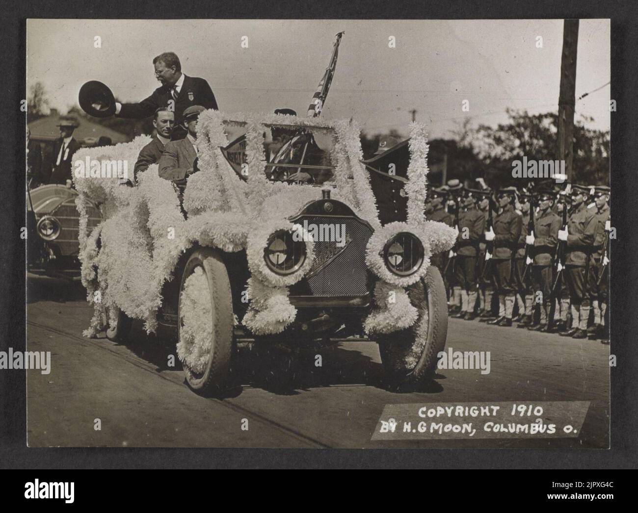 Theodore Roosevelt riding in a parade float Stock Photo - Alamy