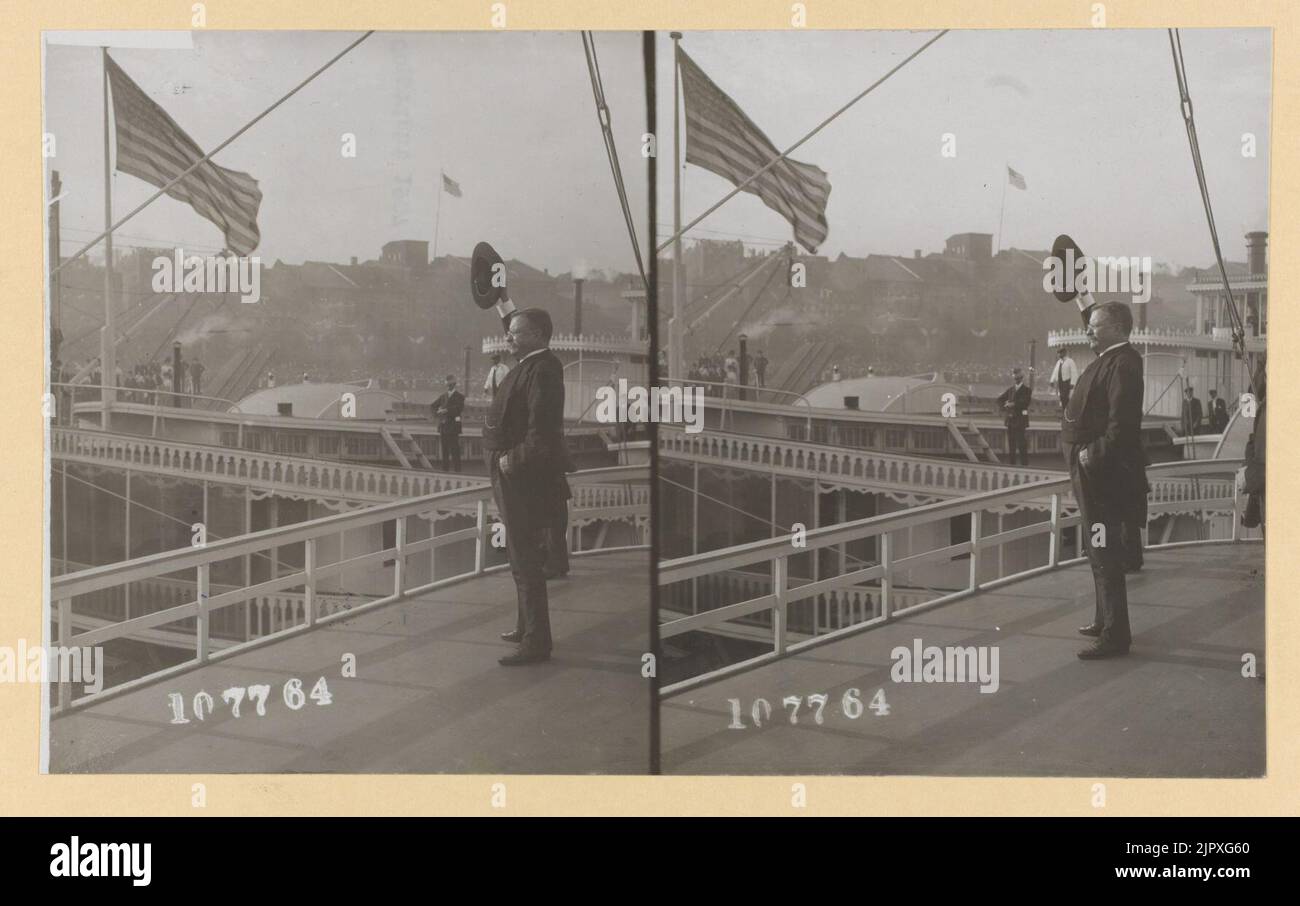 Theodore Roosevelt standing on deck of a ship waving with a hat Stock ...