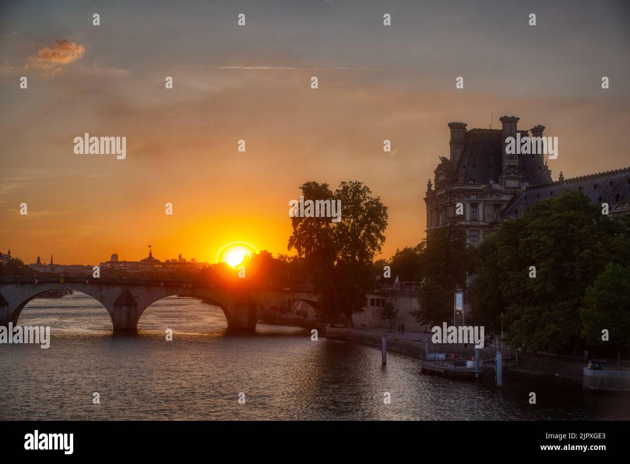 View of the famous bridge called Pont Royal and the Louvre Museum at ...