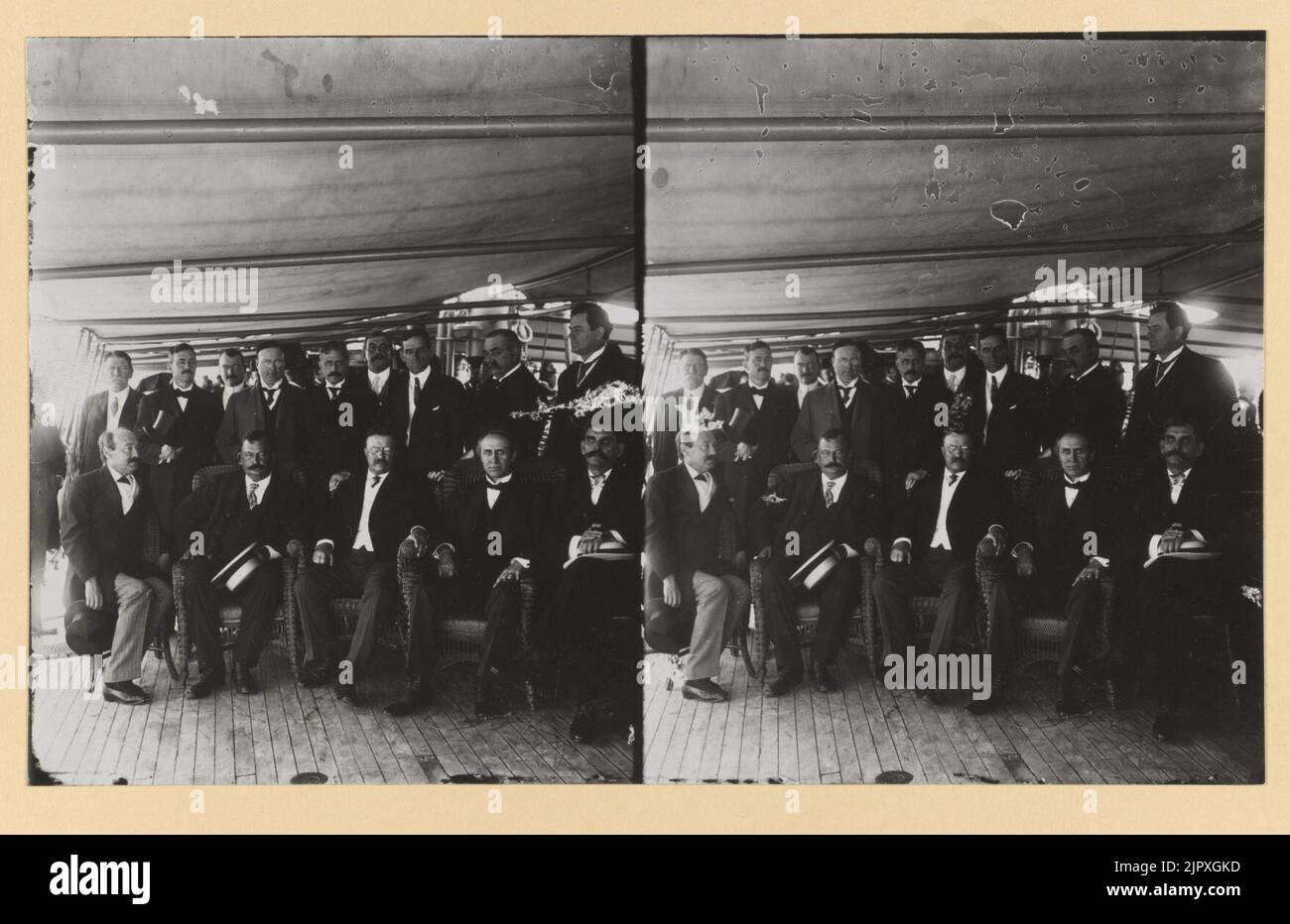 Theodore Roosevelt, seated on deck of ship with group of men, for group ...
