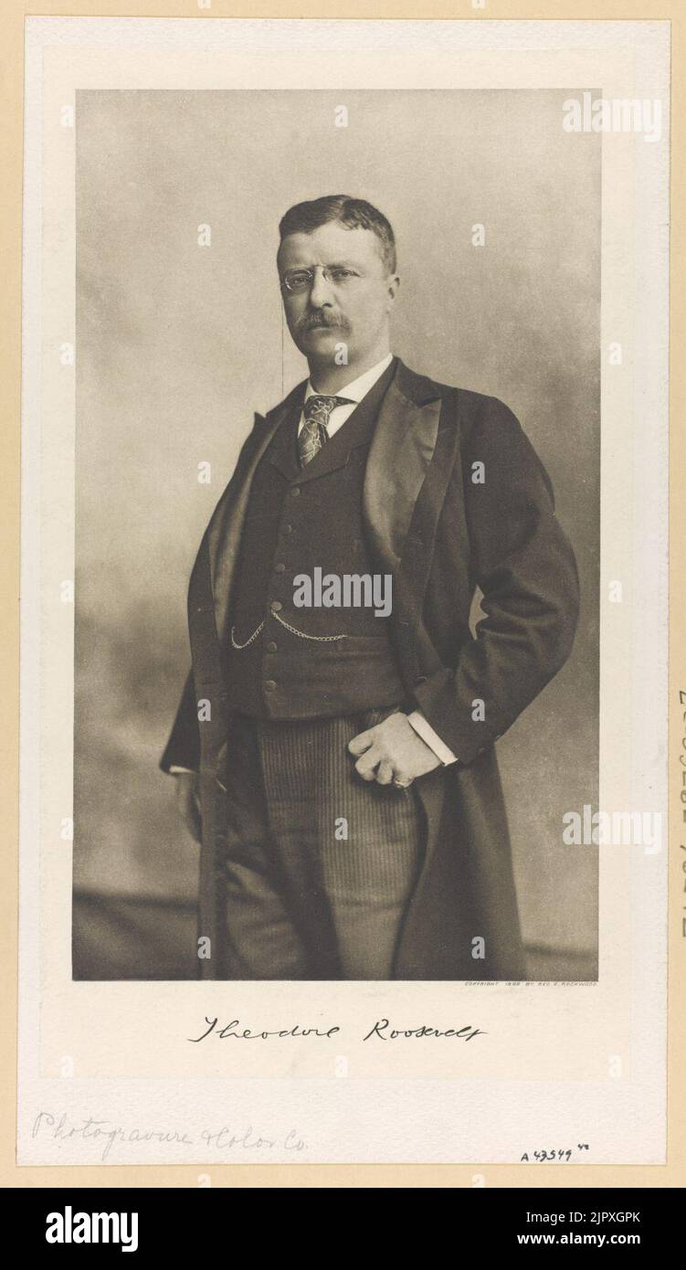 Theodore Roosevelt, three-quarter length portrait, standing, thumb in ...