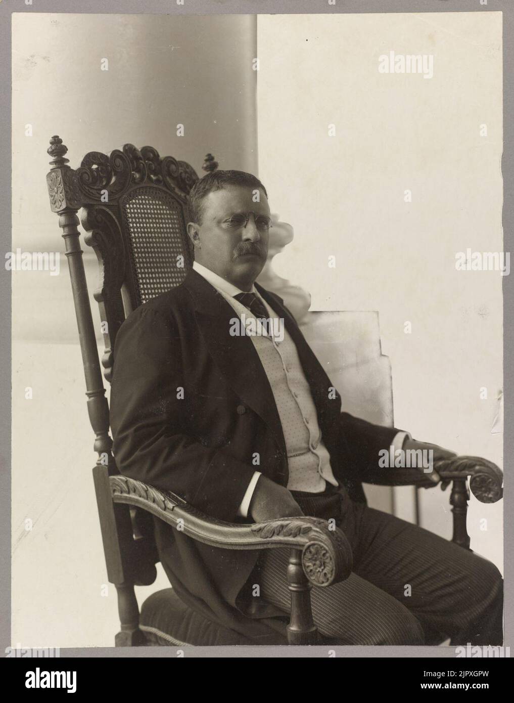 Theodore Roosevelt, three-quarter length portrait, seated, turned right ...